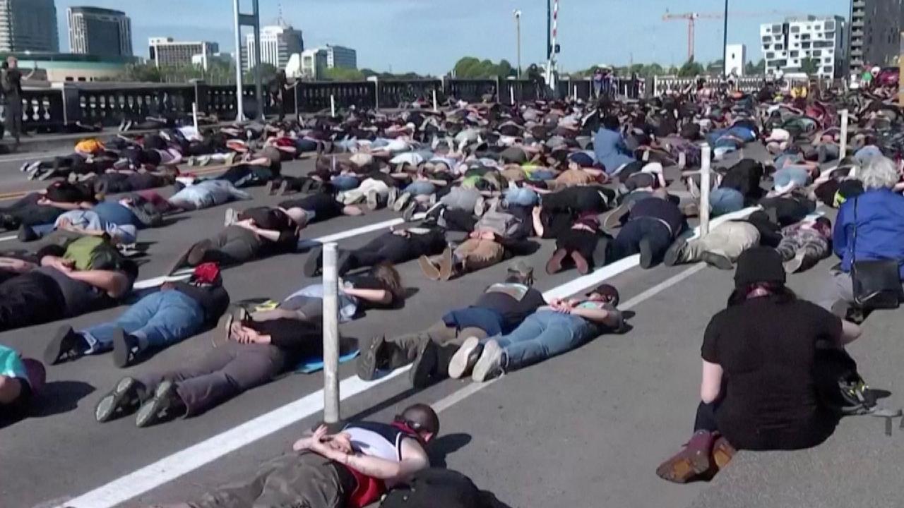 Thousands lie face down for 9 minutes in George Floyd protest - CGTN