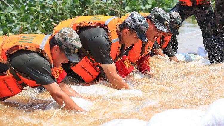 Rescue, relief work underway in China after heavy rain triggers floods ...