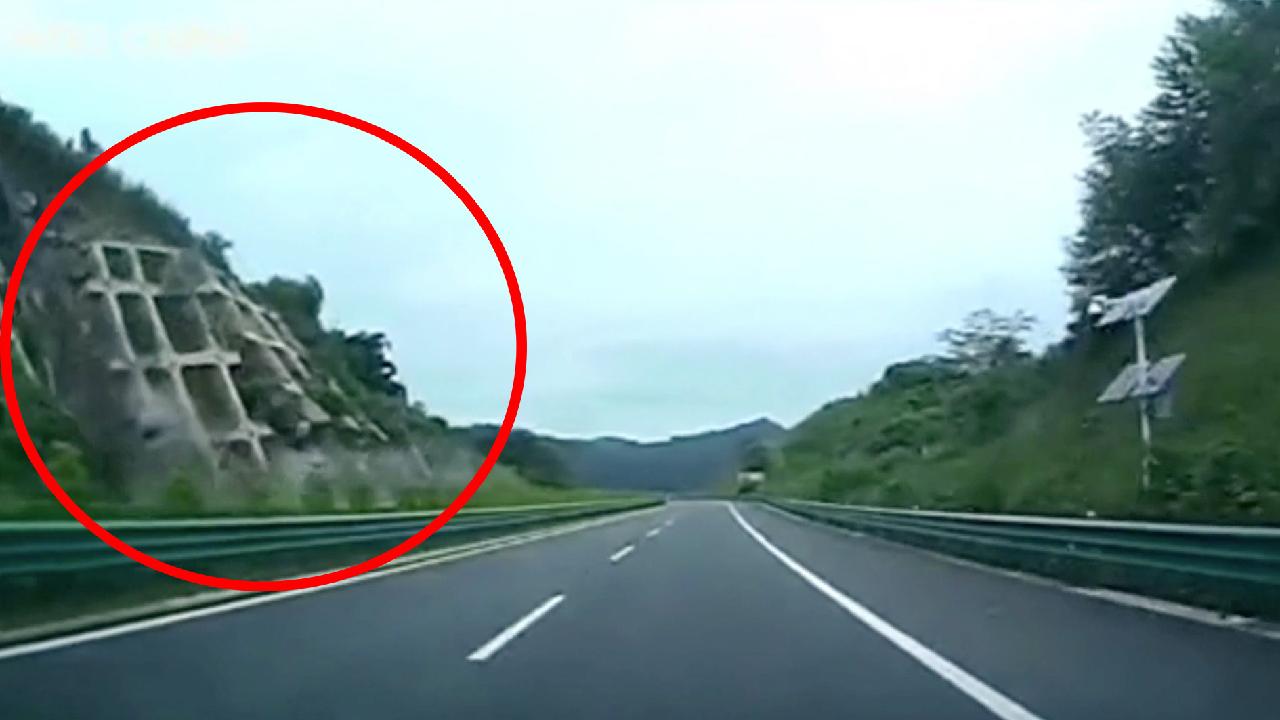 Car narrowly outruns collapsing mountainside on Chinese highway - CGTN