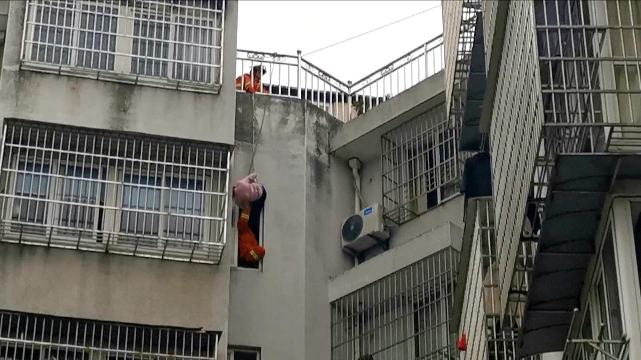Rescuers save girl trapped outside six-story building in east China - CGTN