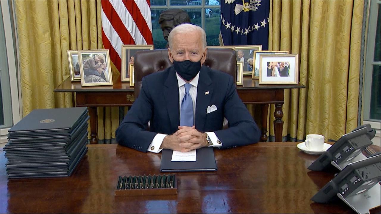Biden signs executive orders on COVID-19, climate change and more - CGTN