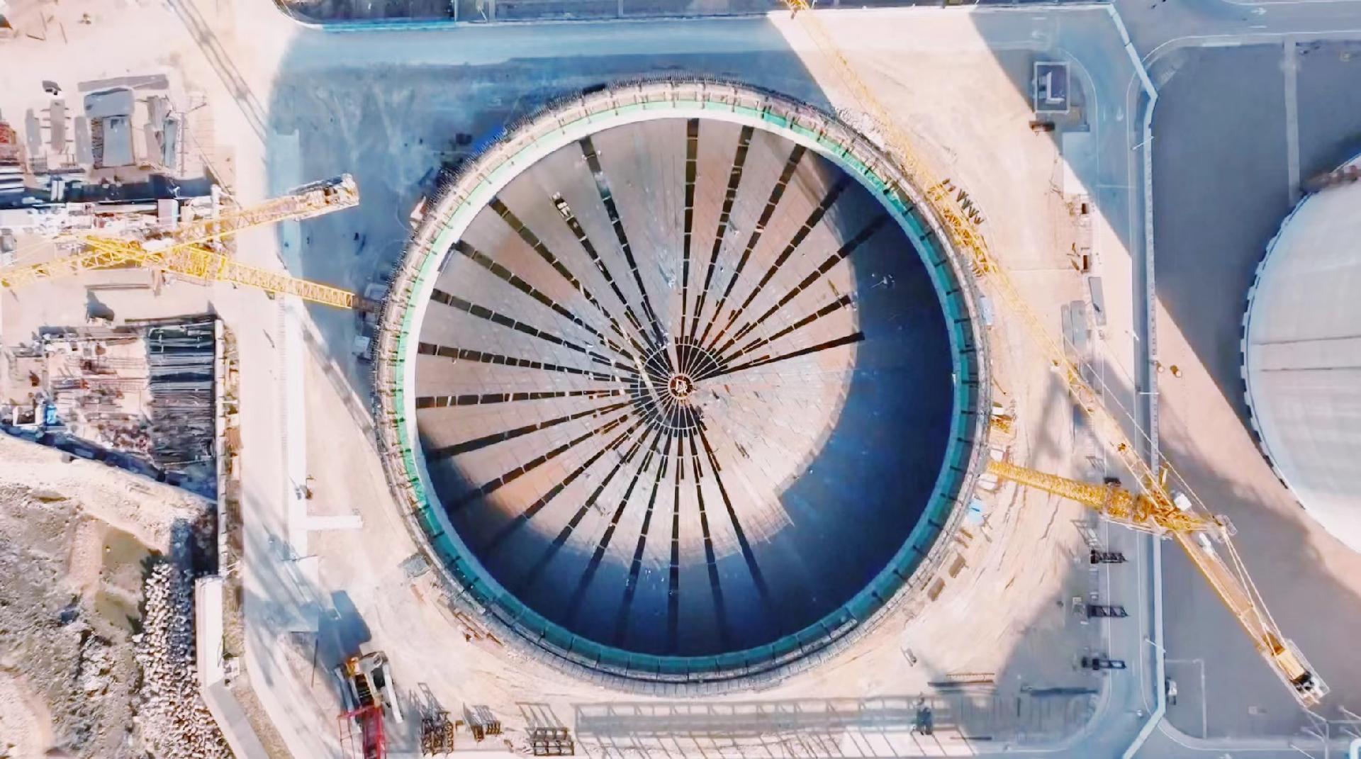 China's largest LNG storage tank finishes dome lifting operation - CGTN