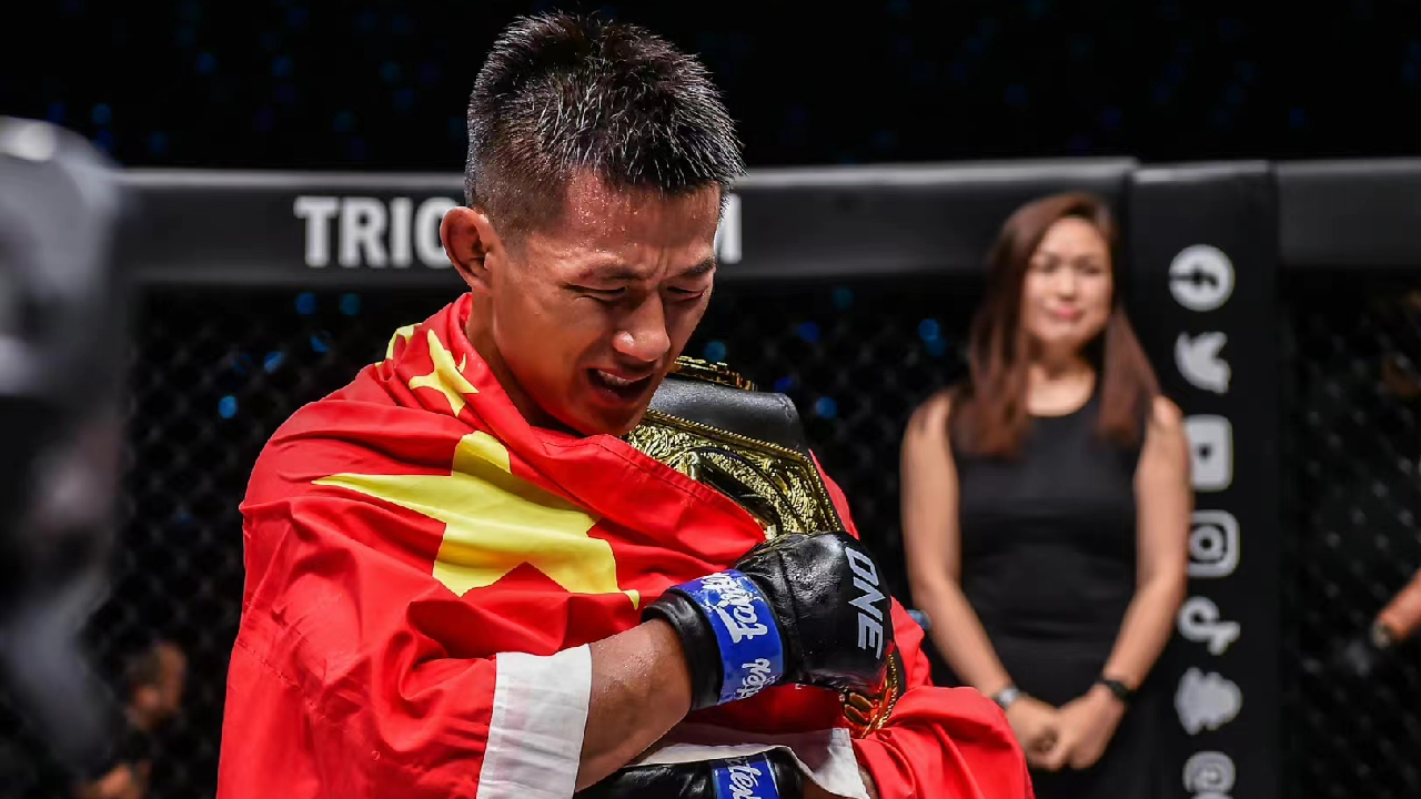 China's Tang Kai makes history with ONE Featherweight World Title - CGTN