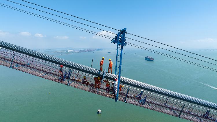 Main cable strands on Lingdingyang Bridge completed in S China - CGTN