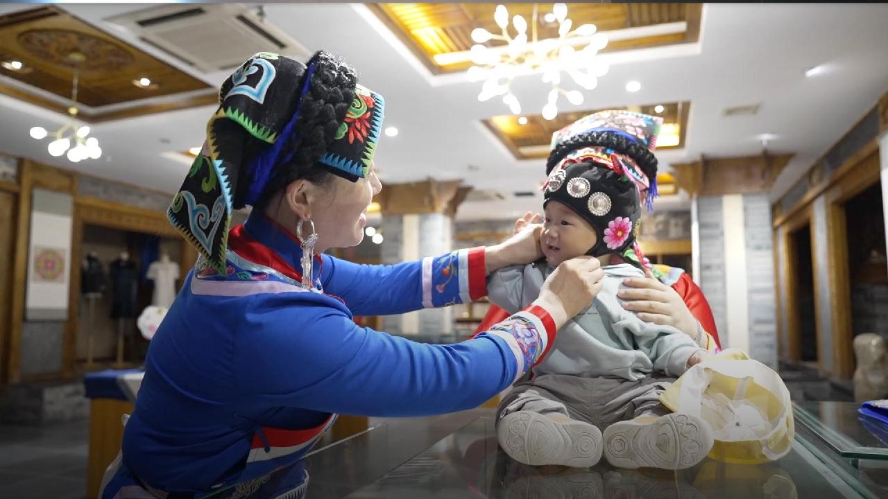 CPC representative on Qiang ethnic group, embroidery style - CGTN