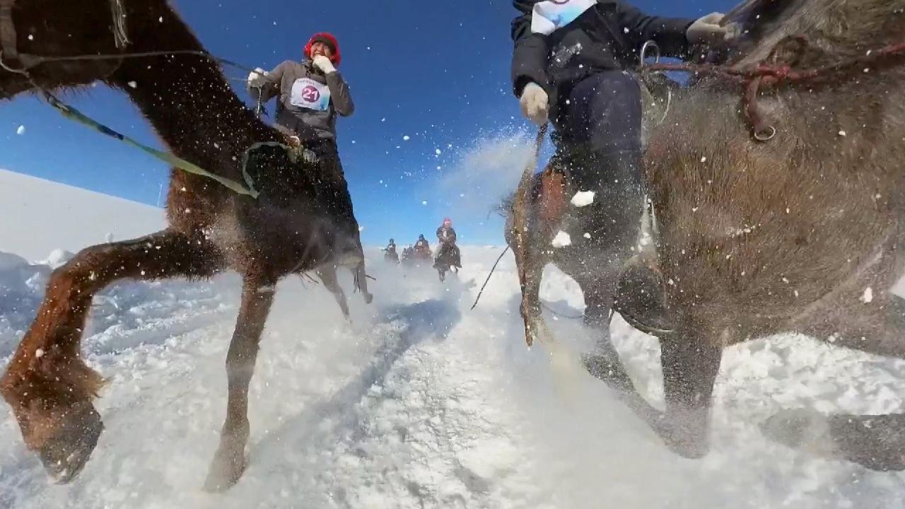 Herdsmen gallop across snowy fields in NW China's Xinjiang - CGTN