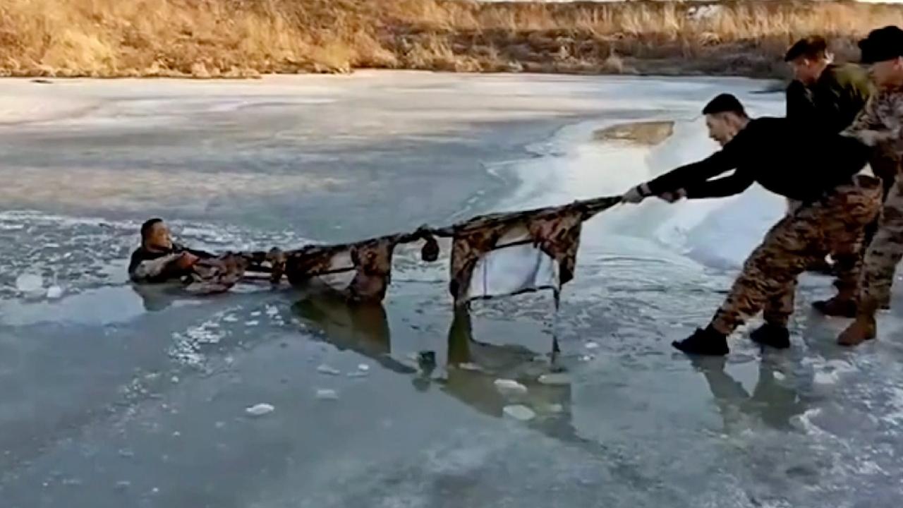 Soldiers make rope out of uniforms to save man trapped in frozen river ...