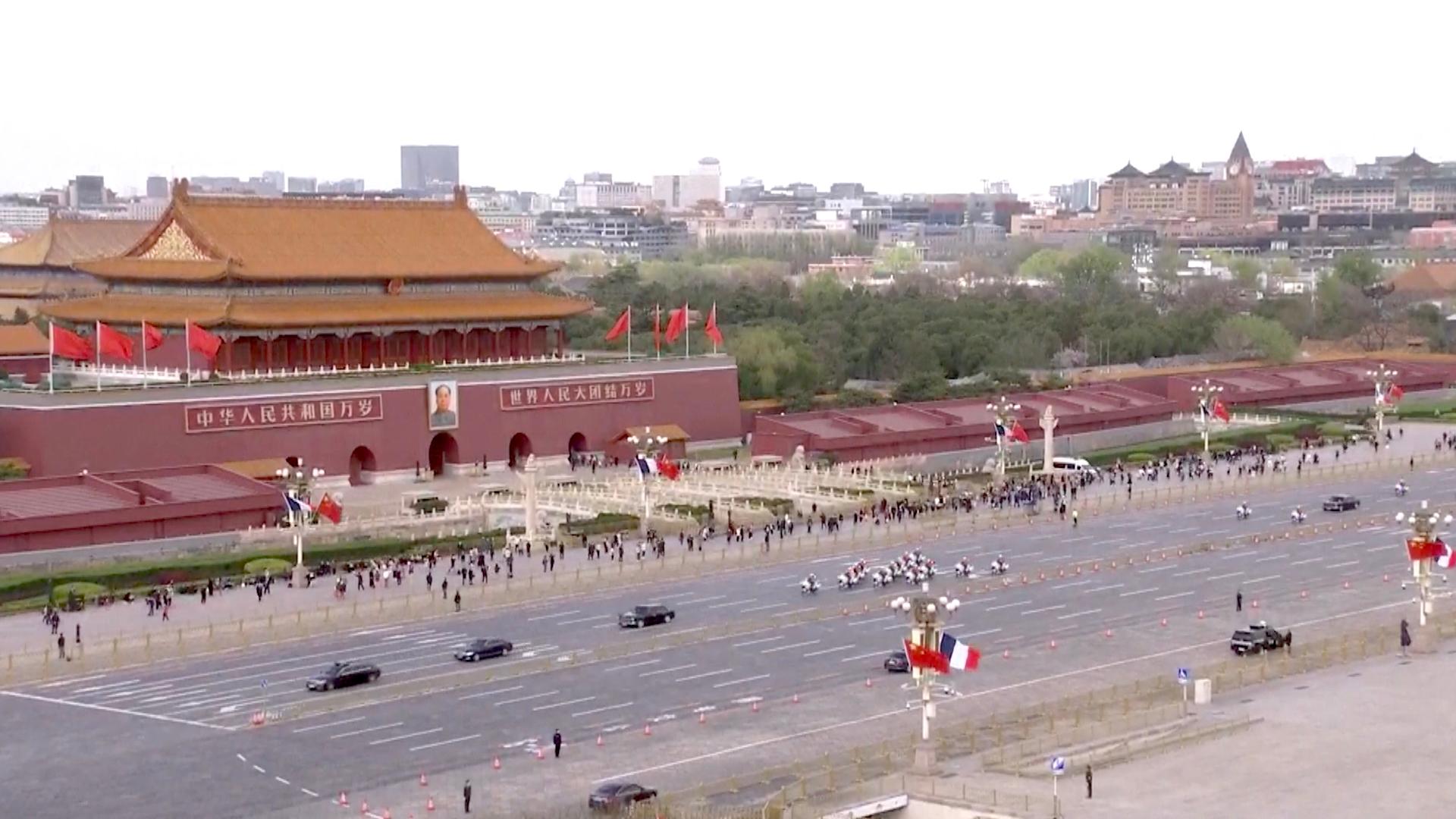 French president Macron's motorcade passes Tiananmen Square - CGTN
