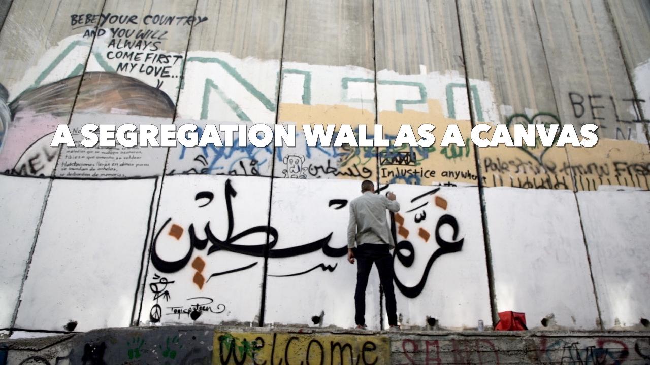 A segregation wall as a canvas - CGTN