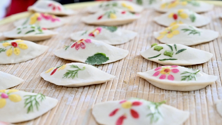 Chinese residents make 'flower dumplings' to mark Spring Festival - CGTN