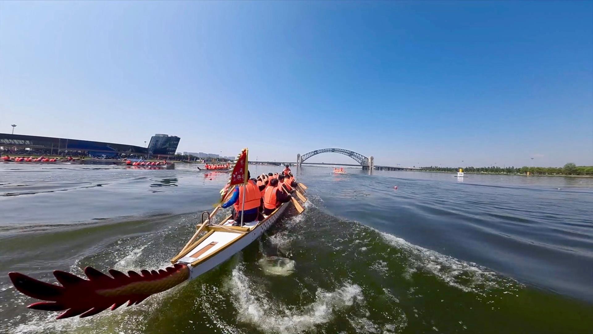 Dragon boats race through Fenhe River in northern China - CGTN