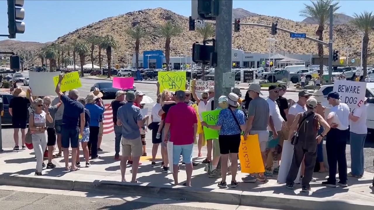 Hundreds protest outside Tesla showroom in Boston - CGTN